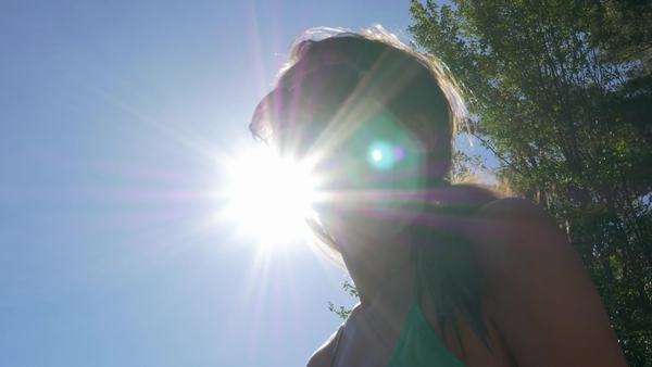 Beautiful women in bikini with sun behind her - Stock Video Footage ...