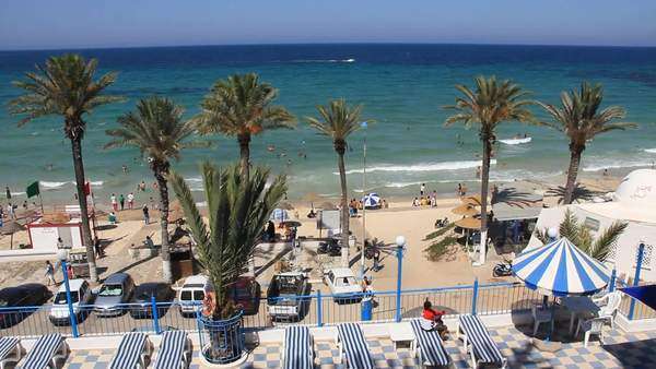 People bathing and sunbathing on the beach - Stock Video Footage - Dissolve