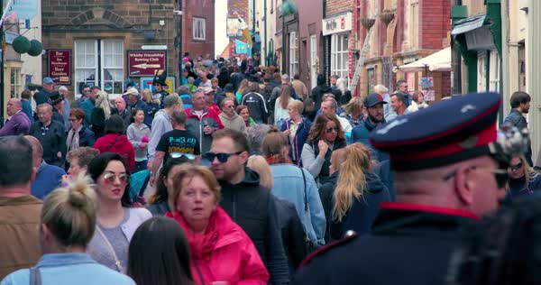 Crowds Of People Walking, Church Street, Whitby, North Yorkshire ...