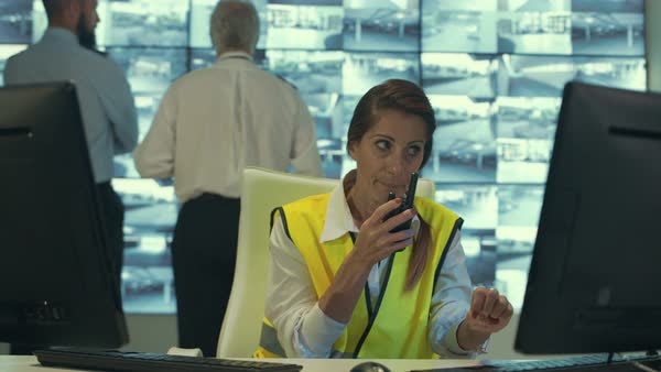 Security team working together in observation control room - Stock ...