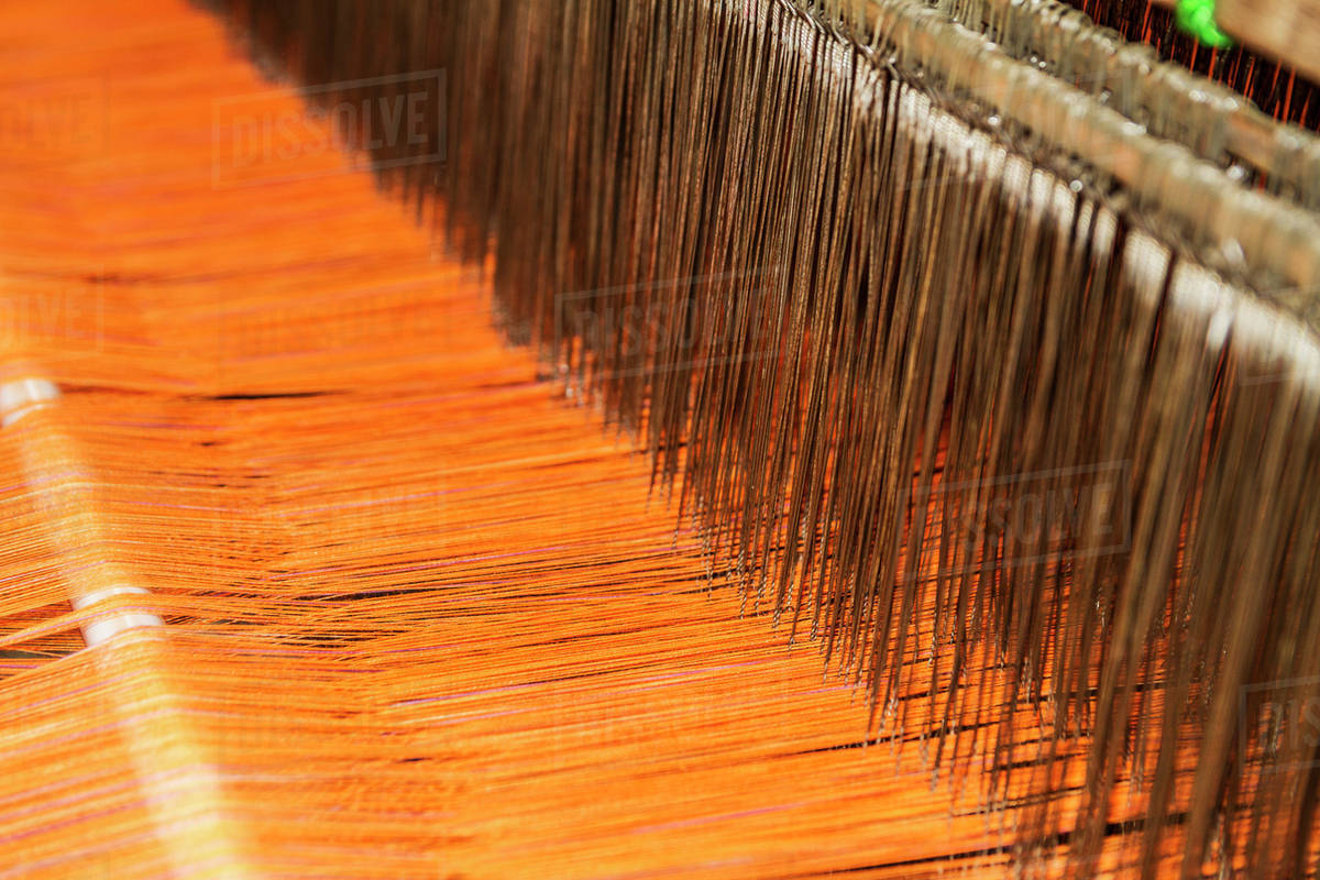 Traditional Lurik cloth being woven on a loom in a lurik workshop in ...
