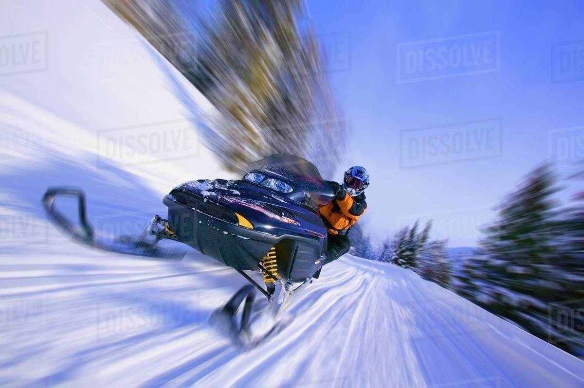 Person On A Snowmobile - Royalty-free Stock Photo | Dissolve