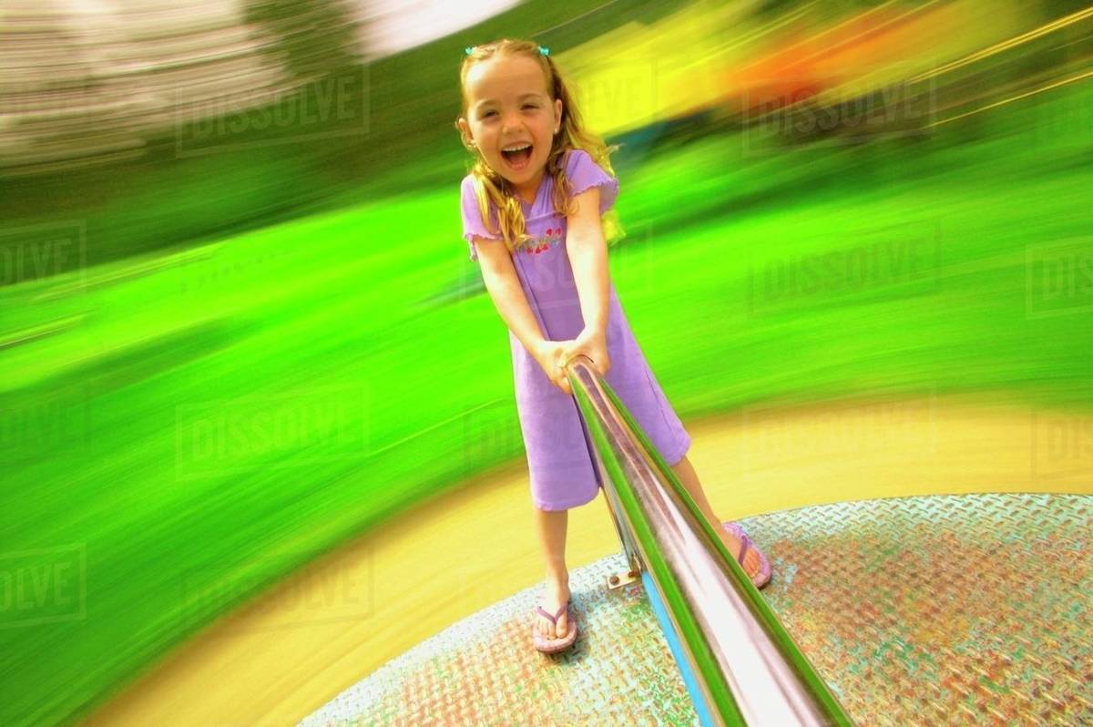 Child On A Merry-Go-Round - Royalty-free Stock Photo | Dissolve