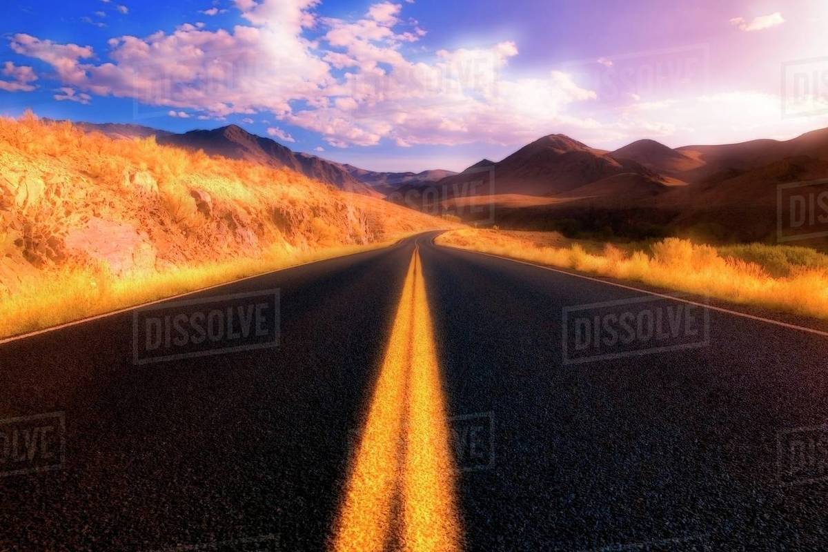 Highway Through Mountains - Stock Photo - Dissolve