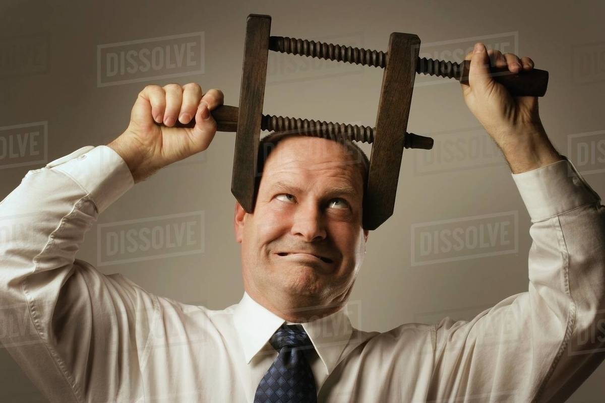 Man With Head In Vice - Royalty-free Stock Photo | Dissolve