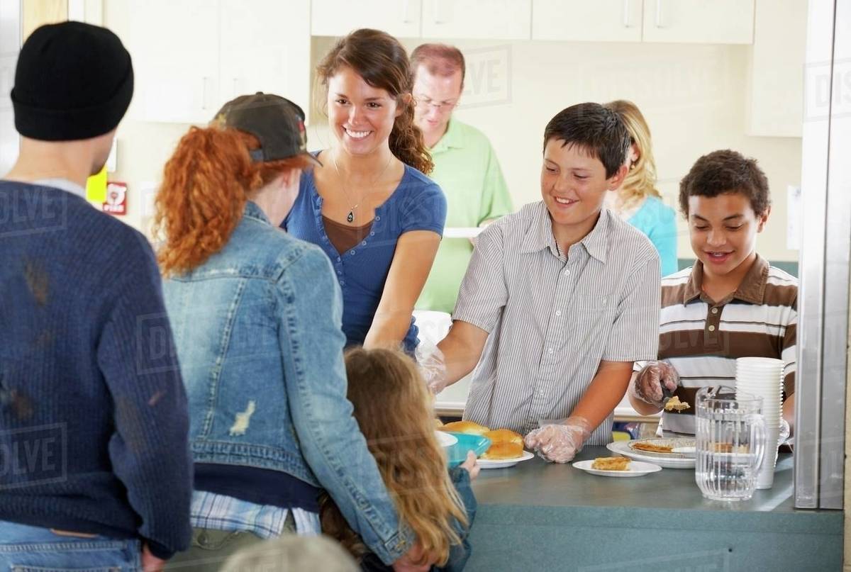 Group Of People At Community Buffet - Royalty-free Stock Photo | Dissolve