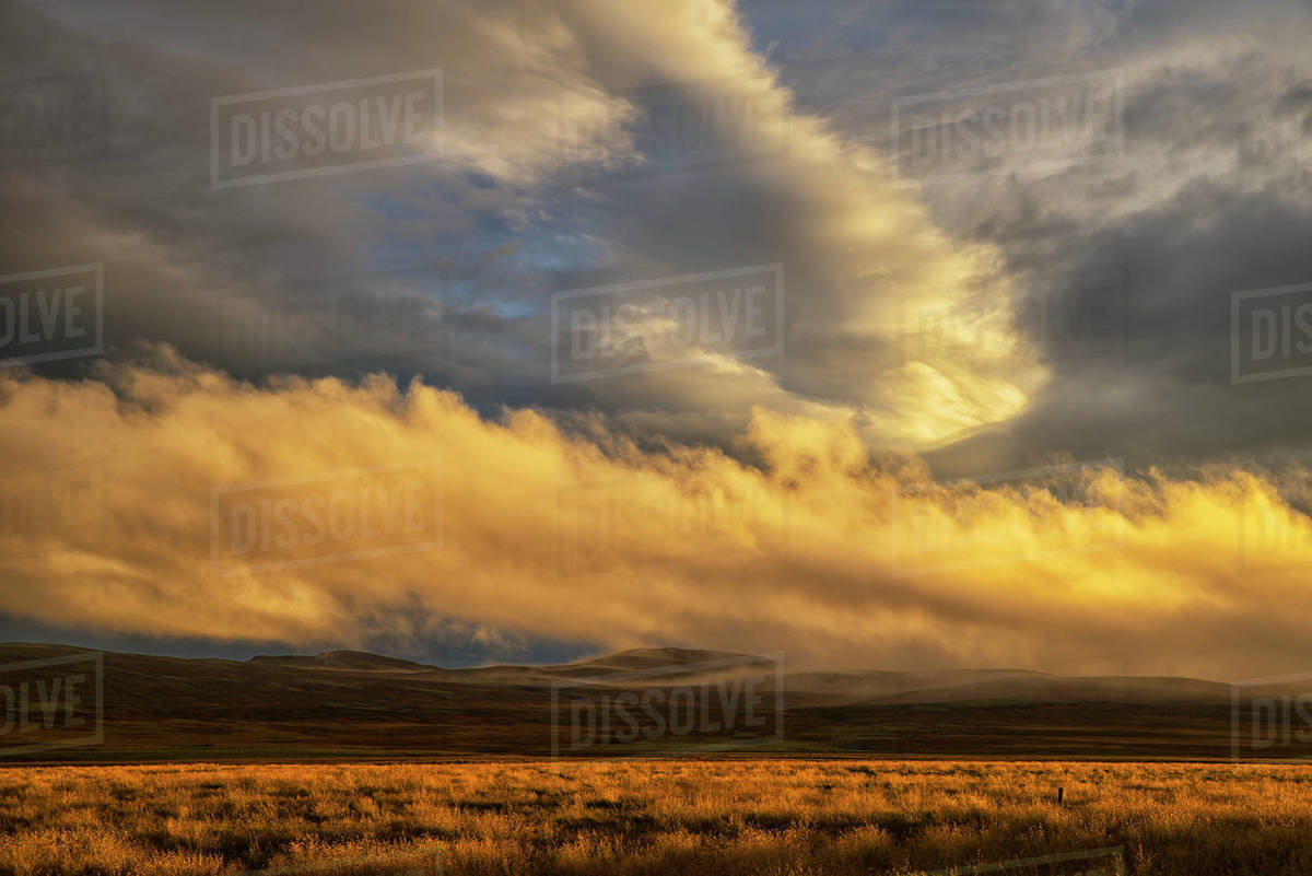 Sunset Lights Up The Clouds While Late Day Sun Casts A Warm Glow On The ...