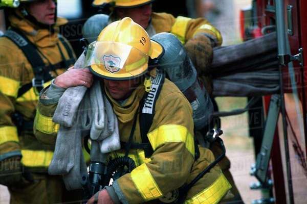 Fireman Carrying Hose - Royalty-free Stock Photo | Dissolve