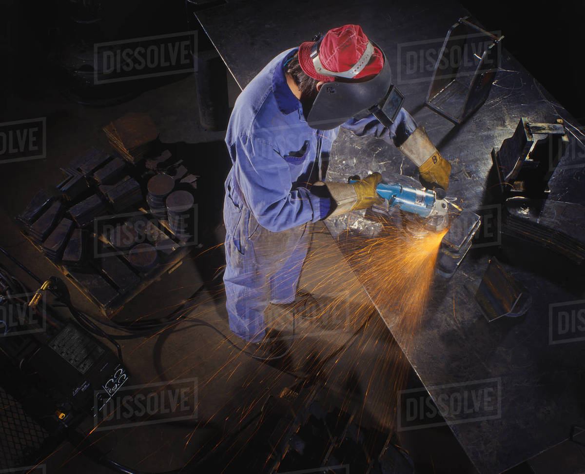 Welder Using A Grinder - Stock Photo - Dissolve