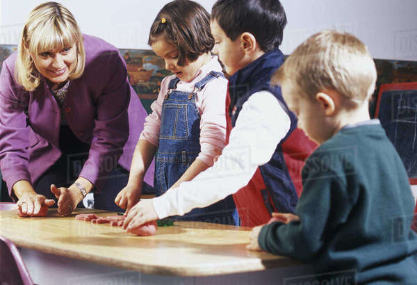 Children Playing With Supervisor - Royalty-free Stock Photo | Dissolve