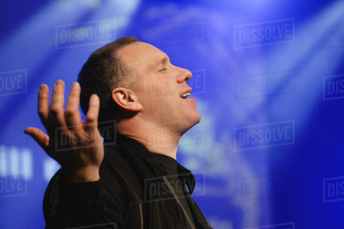 Worship Leader Raising Hands - Royalty-free Stock Photo | Dissolve