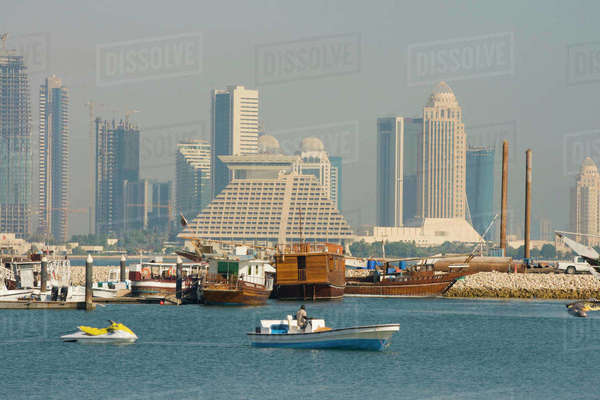 Doha Bay Skyline With Harbor, Doha,Qatar - Stock Photo - Dissolve