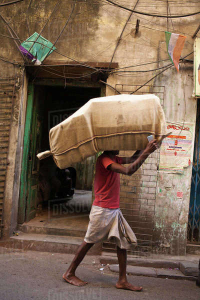 Man Carrying Sack On His Head; Kolkata, West Bengal, India - Stock ...