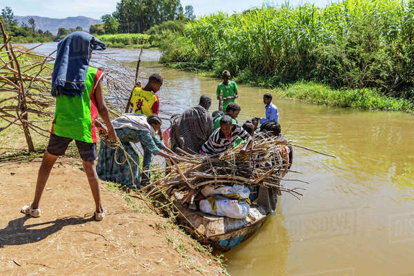 Ethiopian people boarding a boat on the Blue Nile River; Amhara Region ...