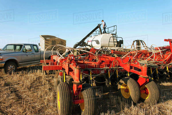 Farmers With Heavy Farm Machinery Planting Lentils In Williams County ...