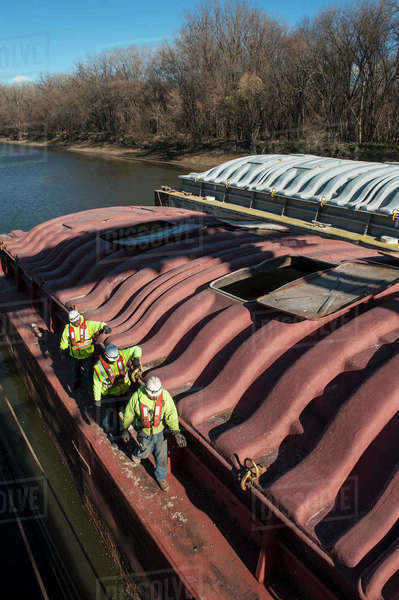 Workers On A Grain Barge That Is Being Loaded With Soybeans For ...