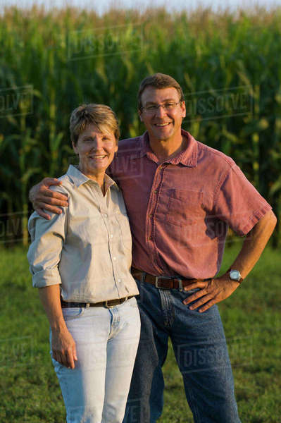 Agriculture - Husband and wife farmers pose together with their ...