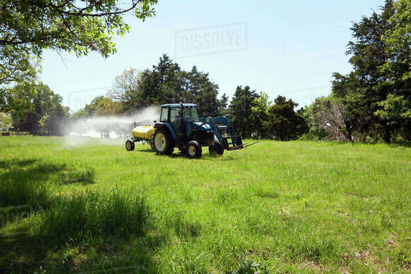 Agriculture - Spraying herbicide on a pasture used for grazing beef ...