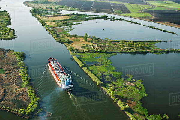 Agriculture - Aerial view of an ocean going grain ship transiting the ...