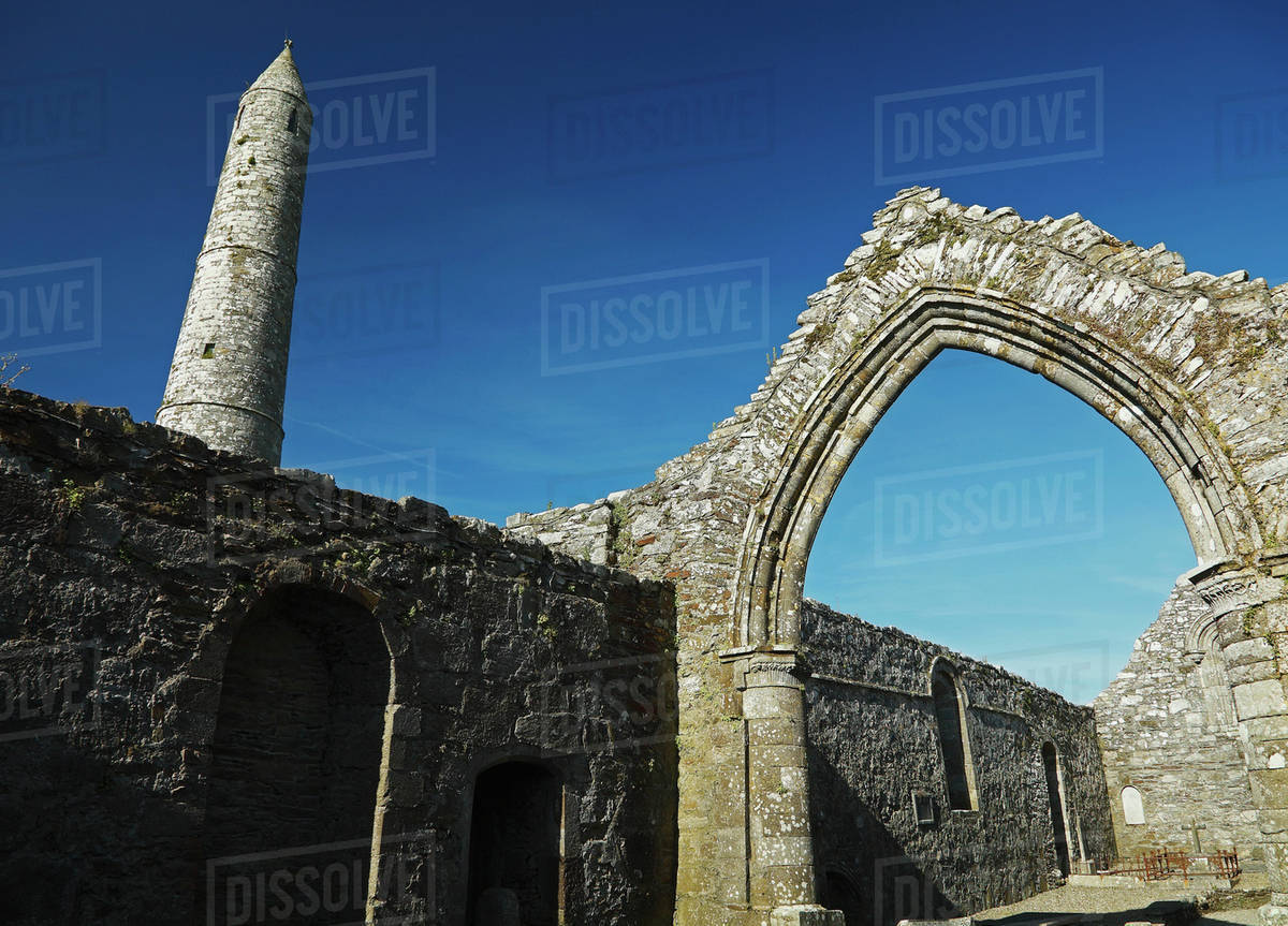 The round tower and ruins of the cathedral in Ardmore village; Ardmore ...