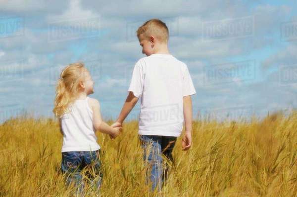 Two Young Children Holding Hands - Royalty-free Stock Photo | Dissolve