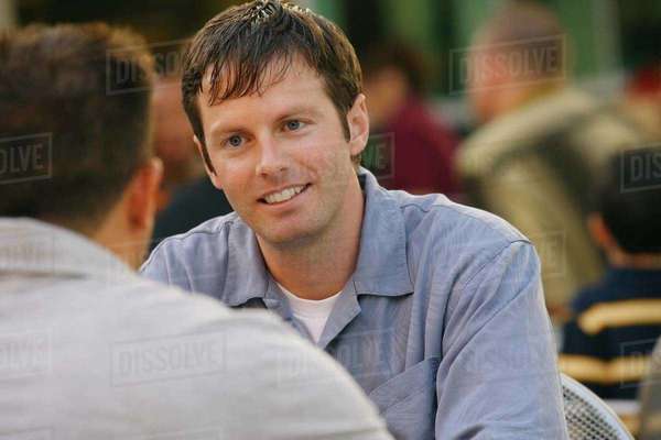 Man Sitting And Talking - Stock Photo - Dissolve