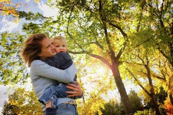 Mother Embracing Child - Royalty-free Stock Photo | Dissolve
