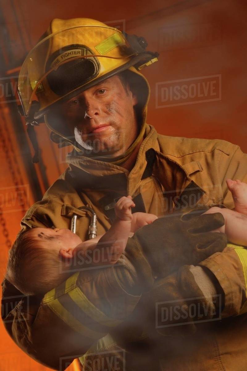 Fireman Rescuing A Baby - Royalty-free Stock Photo | Dissolve