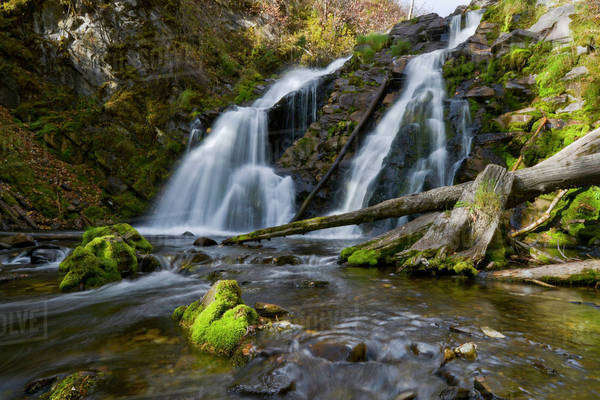 Waterfall over moss covered rocks; Fernie, British Columbia, Canada ...