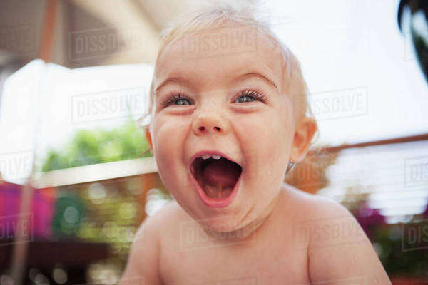 A baby boy with an excited expression on his face; Toronto, Ontario ...