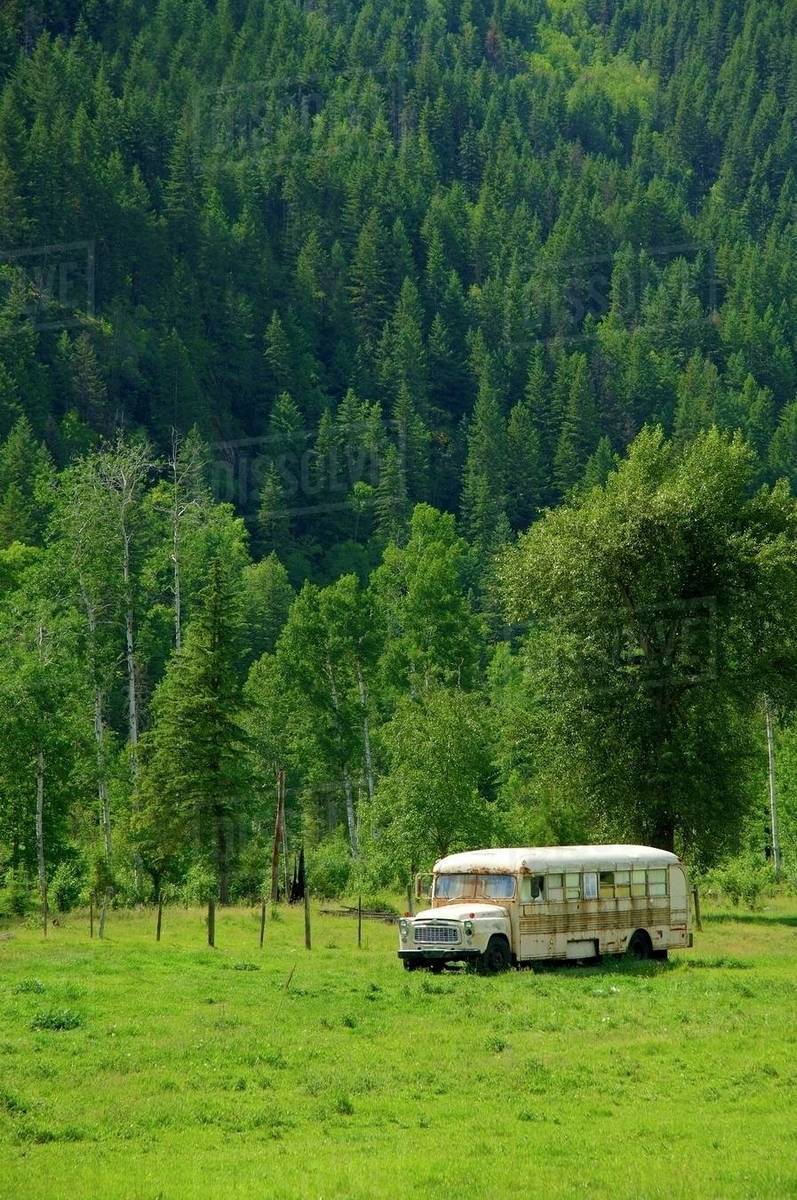 Old Bus In Field - Stock Photo - Dissolve