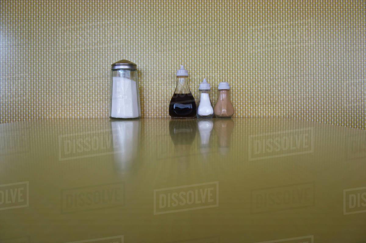 Condiments lined up on a restaurant table; London, England - Stock ...