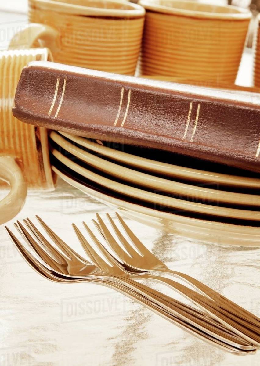 Bible With Dinnerware - Stock Photo - Dissolve