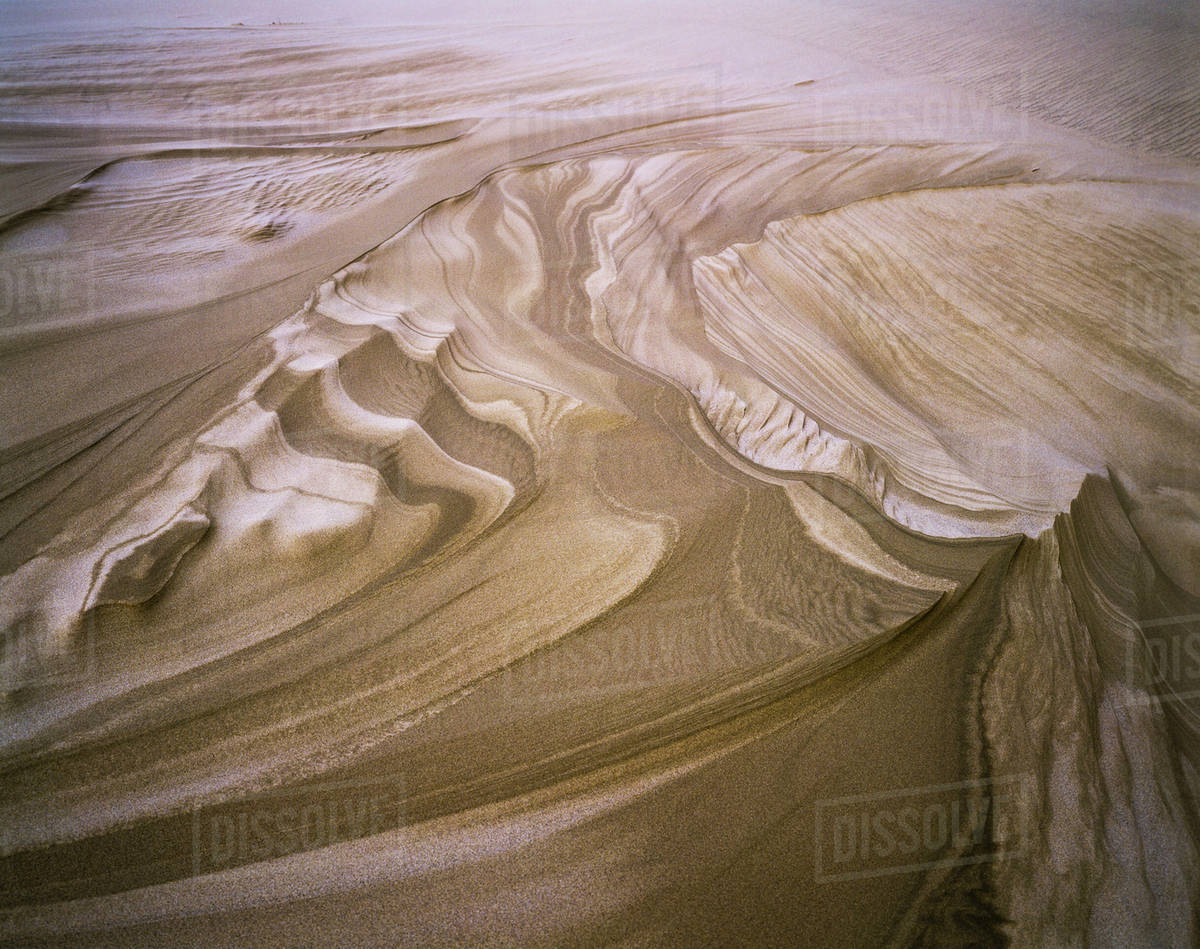 Erosion reveals layers of sand; Lakeside, Oregon, United States of ...