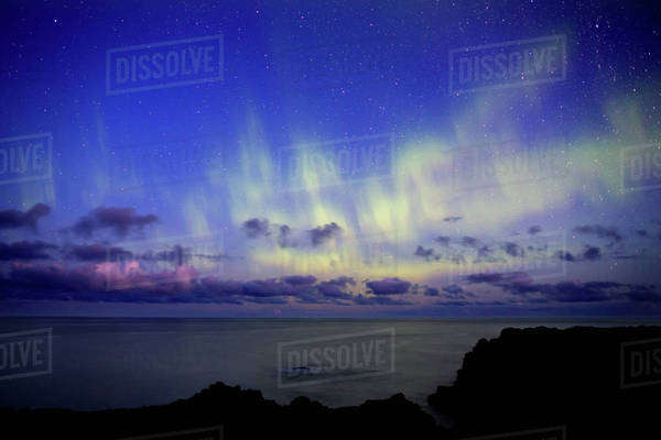 Dramatic scene of the northern lights showing the Atlantic Ocean off ...