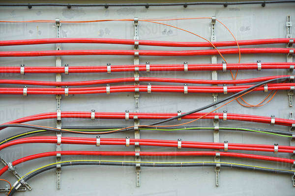 Cables lining a wall; London, England - Royalty-free Stock Photo | Dissolve