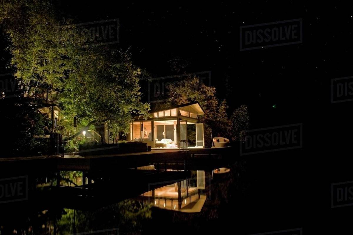 Cottage Lit Up At Night, Lake Of The Woods, Ontario, Canada - Royalty ...