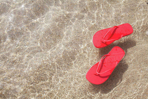 Red beach slippers floating in the ocean;Honolulu oahu hawaii united ...