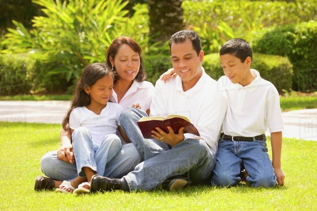 A Family Reading Together - Royalty-free Stock Photo | Dissolve