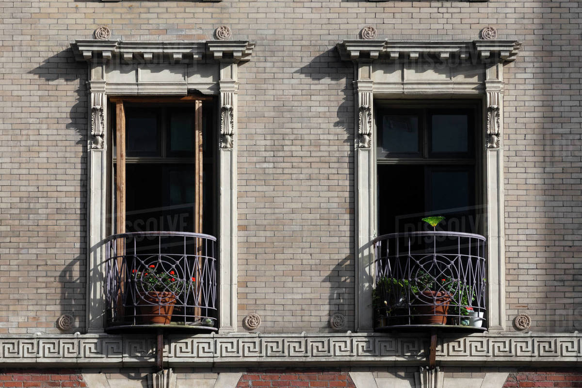 Decorative balconies on a residential building. The wrapped wrought ...