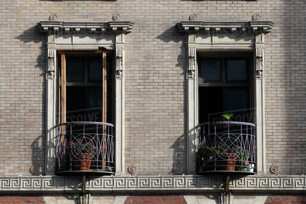 Decorative balconies on a residential building. The wrapped wrought ...