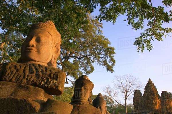 Head Statues And Distant Ruins, Angkor Wat Temple Complex, Angkor Thom ...
