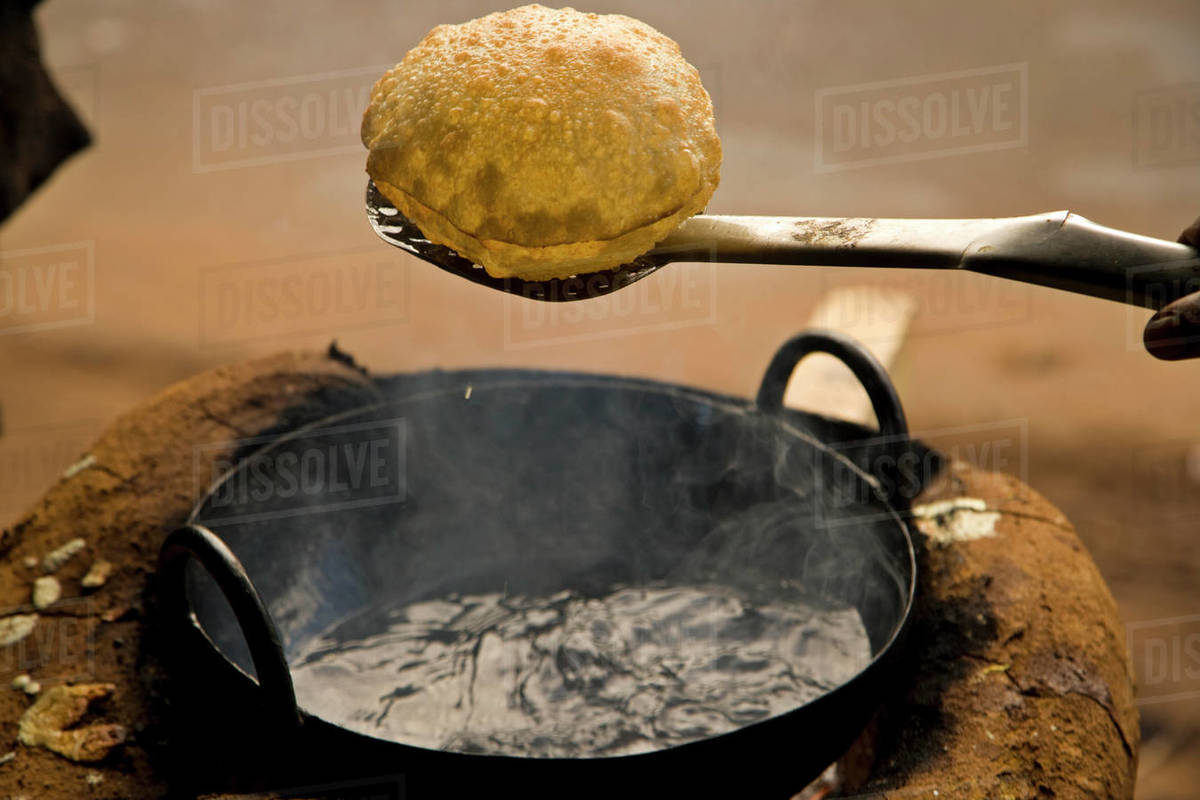 Fresh fried poori, or puri, on the streets of India; Karaikudi ...