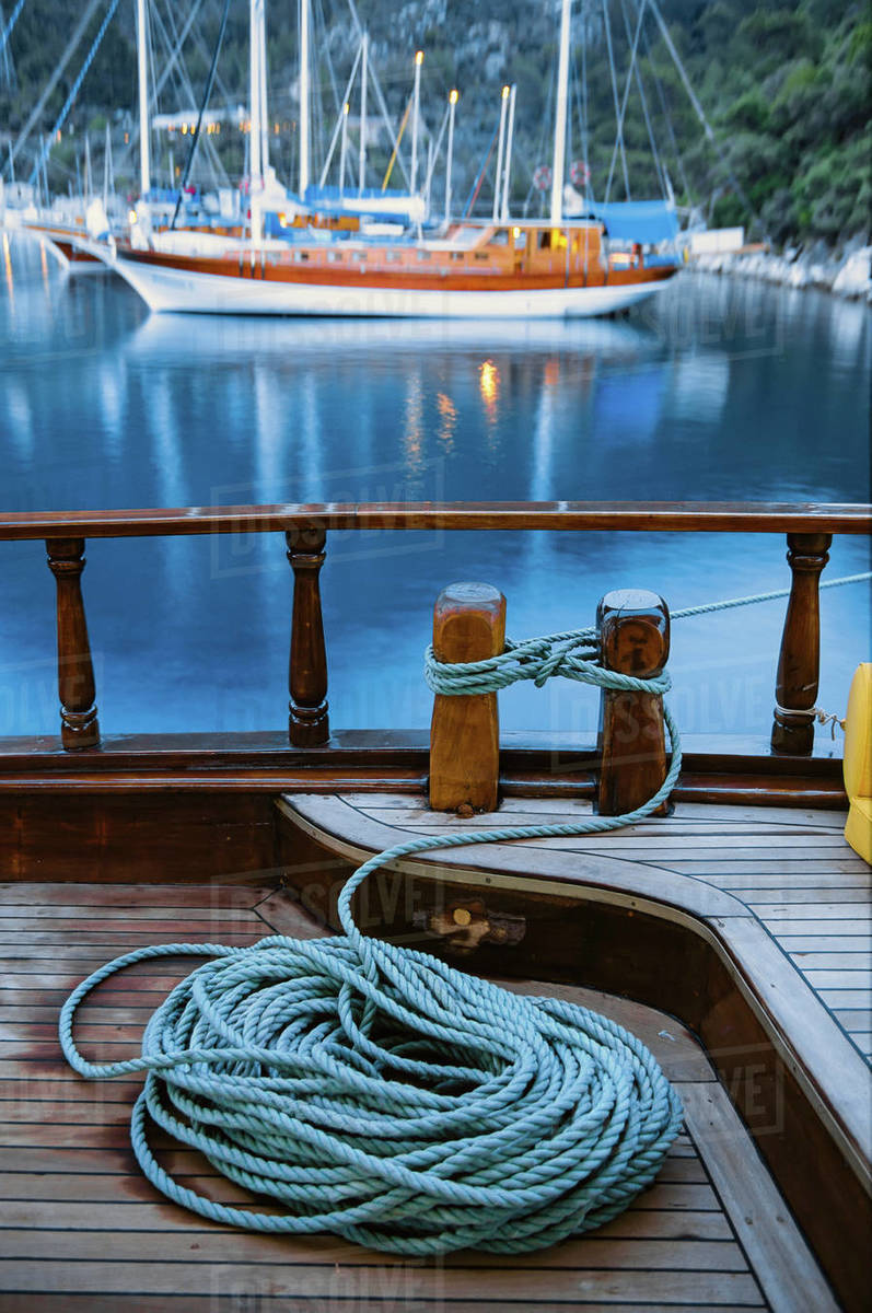 Sailing yachts at anchor in striking blue waters; Ekincik Bay, Turkey ...
