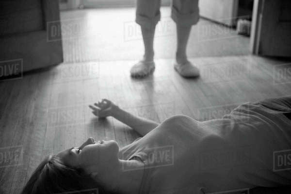 Person stands by a woman who appears to be dead in an infrared image ...