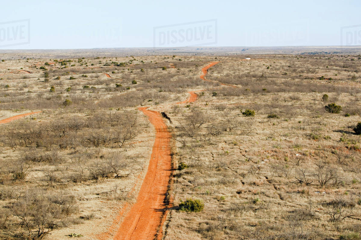 Agriculture - Aerial view of a dirt road passing through West Texas ...