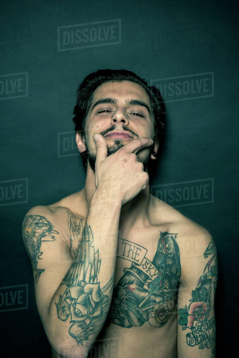 Studio portrait of a tattooed young man. - Royalty-free Stock Photo ...
