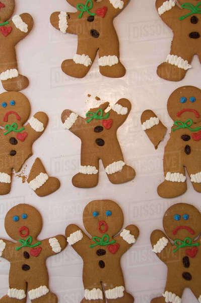 Cookie sheet of gingerbread men with different facial expressions ...