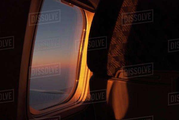 Inside an airplane with a view out the window at sunset; Mexico - Stock ...