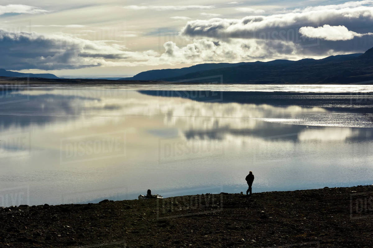 Expedition team member leaves his trusty boat behind him and the ...